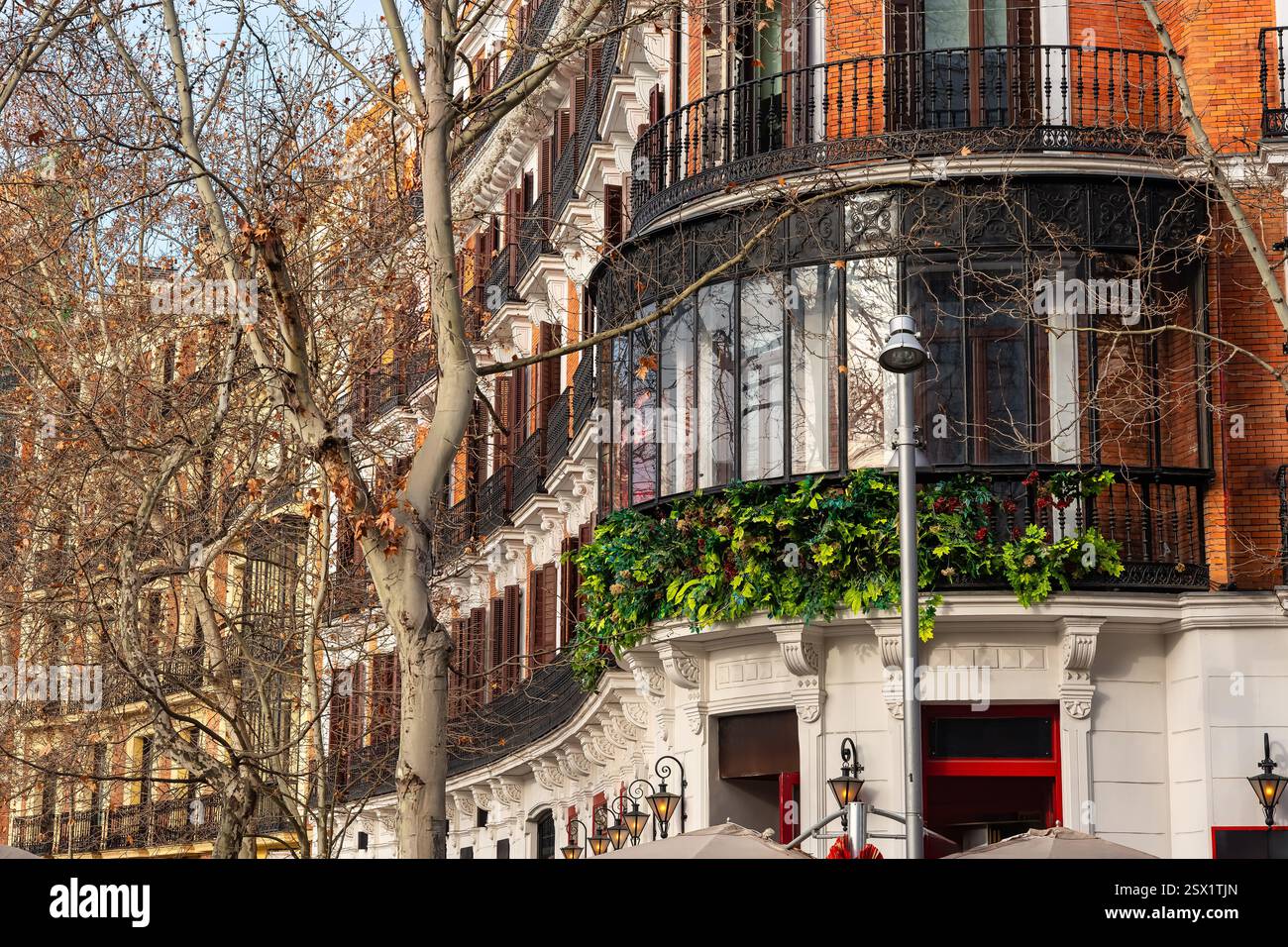 Facades of classic buildings on Madrid's Calle Serrano, a luxury ...