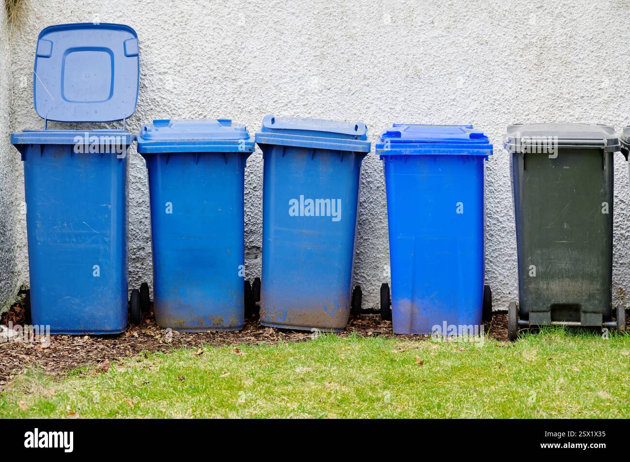 Wheelie bins in row for refuge collection outdoors Stock Photo - Alamy