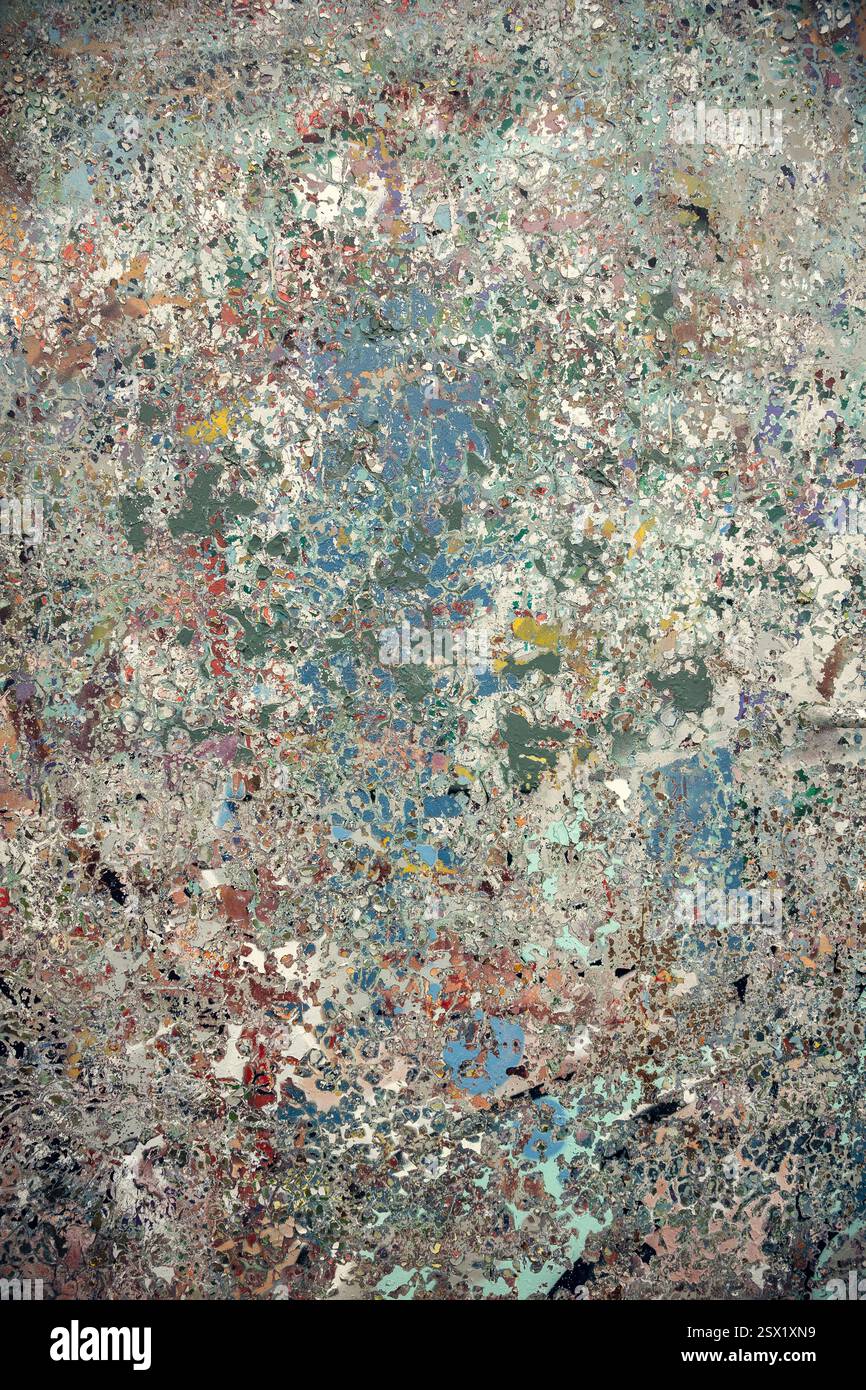 Abstract textured surface featuring distressed layers of paint in blue ...