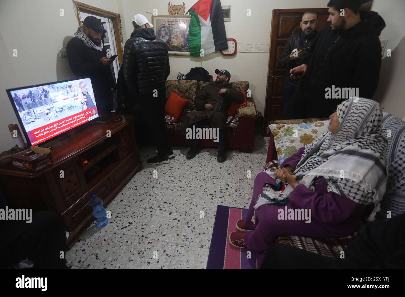 Palestinian Zahdia Khadisha 90 years old watches television to ...