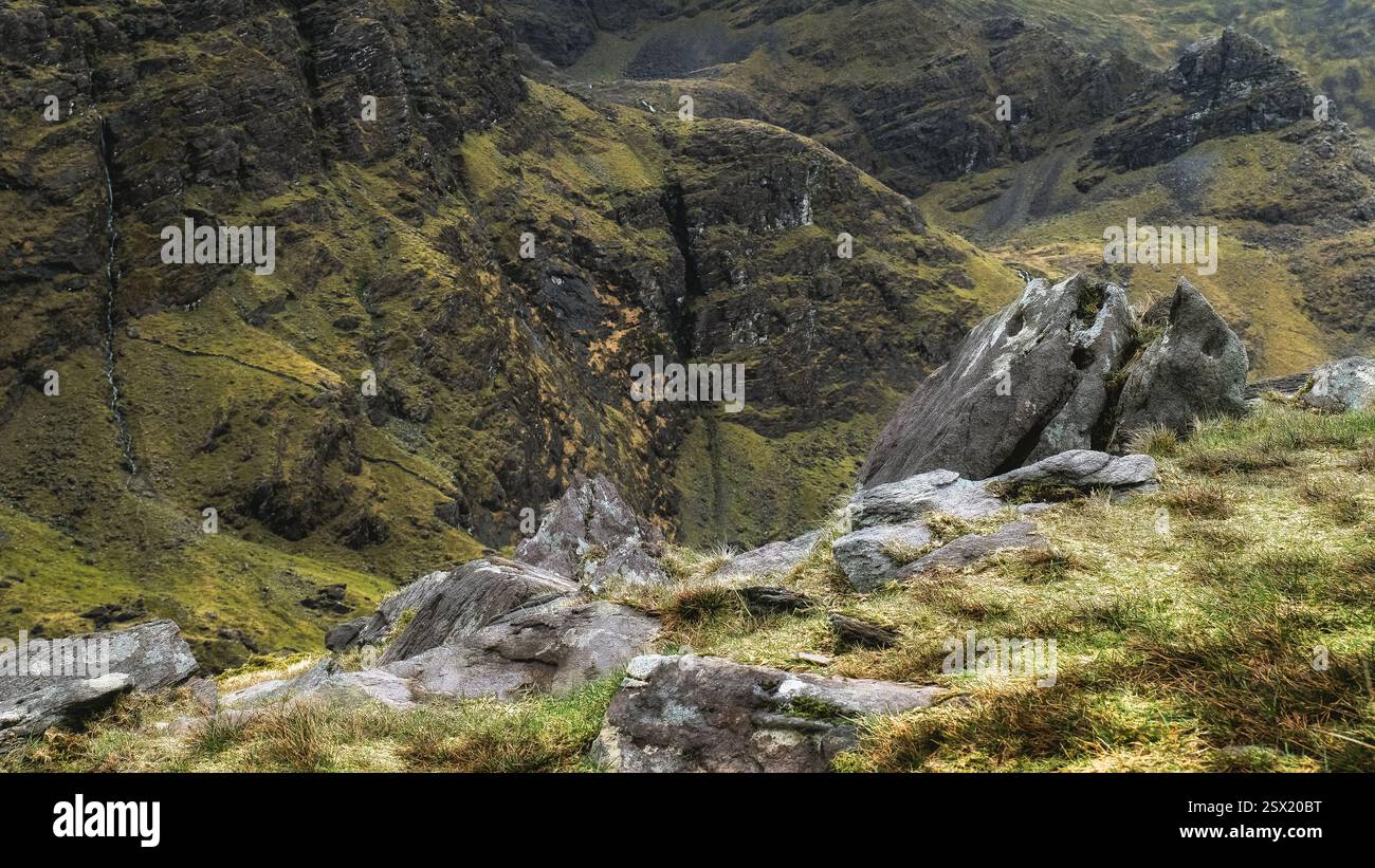 The stunning Carrauntoohil walkway, surrounded by dramatic rocky ...