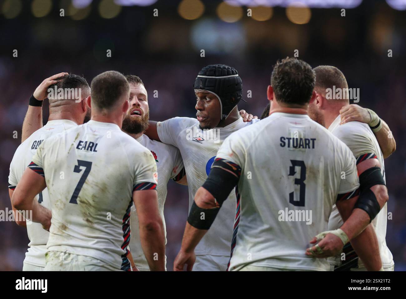 England's Maro Itoje, center, talks to his players during the Six Nations rugby union match ...