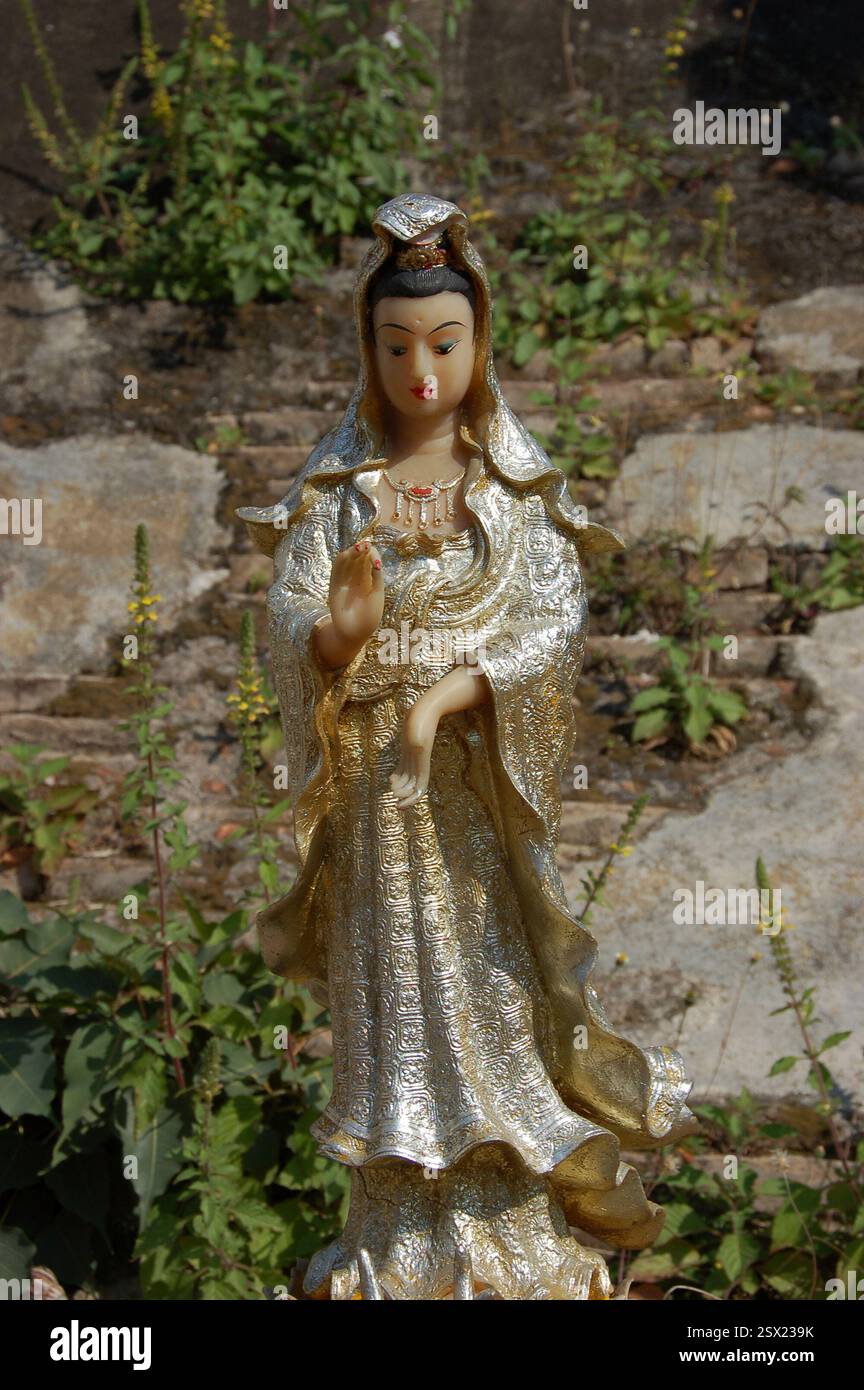 Golden statue of a female deity at Wat Chedi Luang temple in Chiang Mai ...
