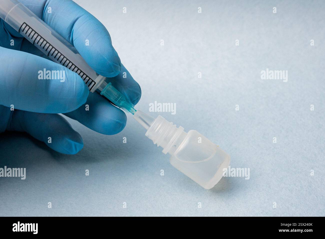 Taking medication with a syringe Stock Photo - Alamy