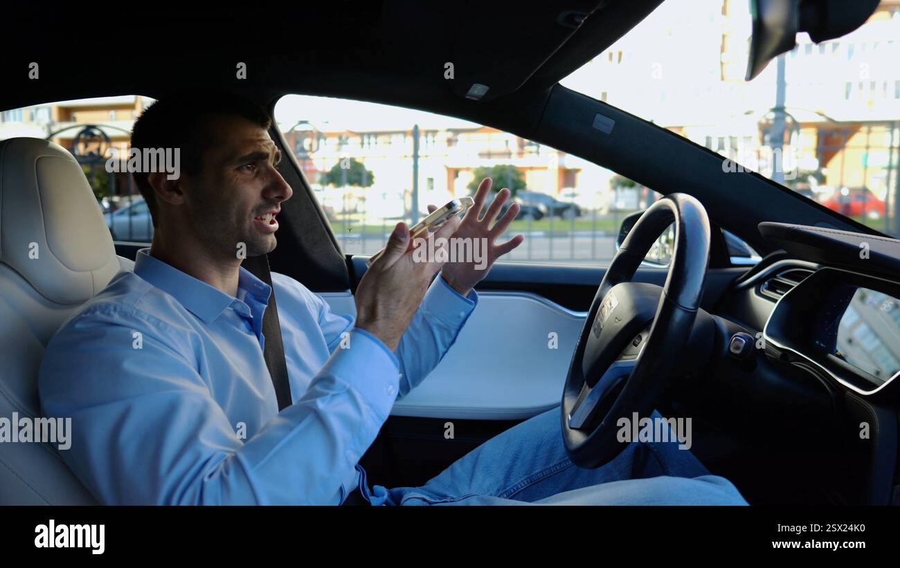 Male businessperson have serious telephone conversation while riding an ...