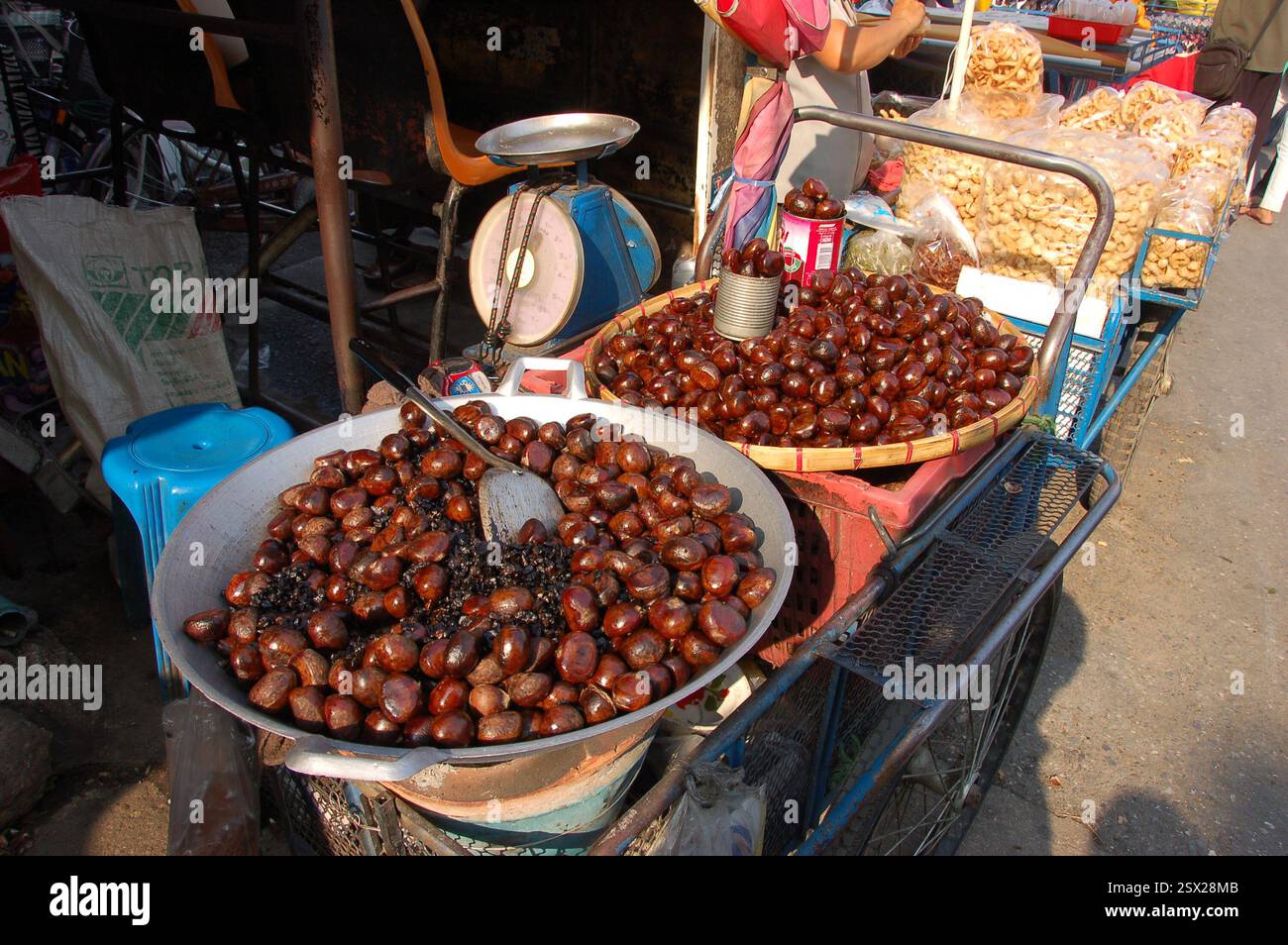 A street vendor's cart in Thailand's Golden Triangle displaying two ...