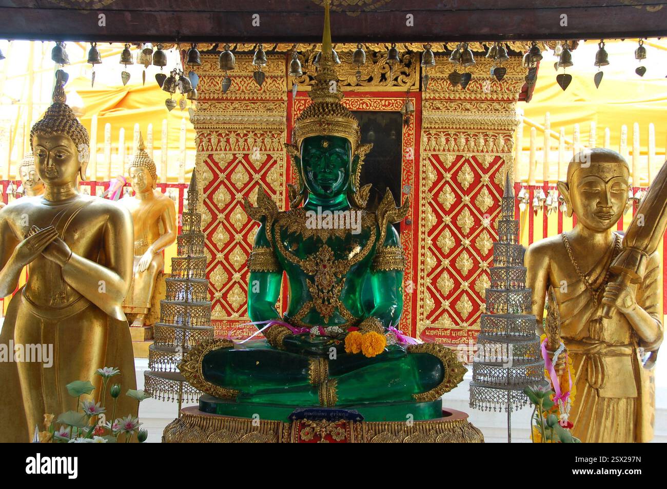 Green jade Buddha statue at Doi Suthep temple, Chiang Mai, flanked by ...