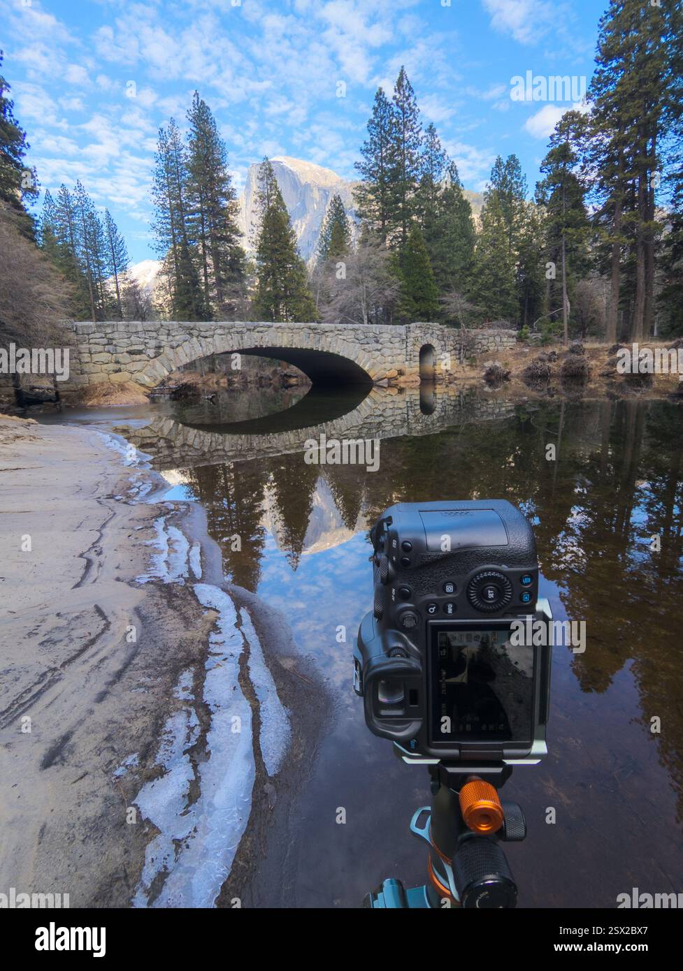 Half dome and a stone bridge reflected in the merced river Stock Photo - Alamy