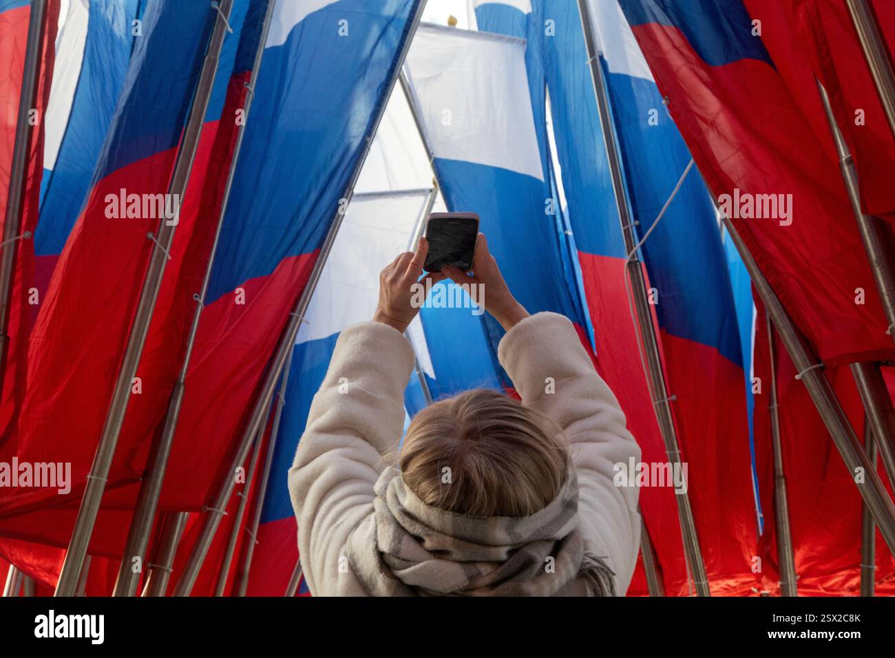 Moscow, Russia. 22nd of February, 2025. A woman takes a selfie in ...
