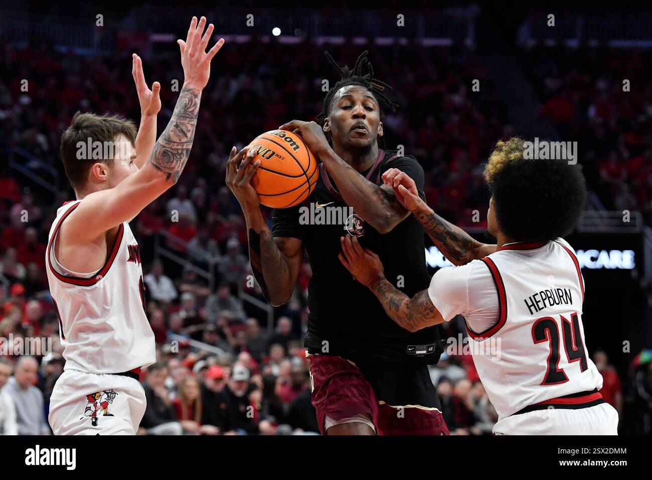 Florida State guard Jamir Watkins (1) attempts to keep the ball away ...