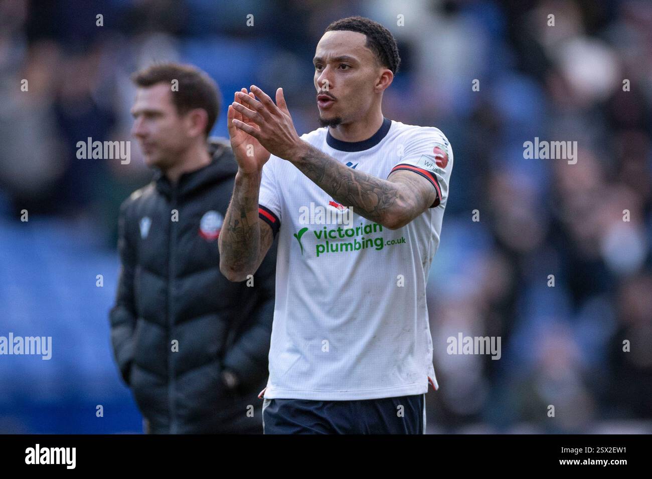 Josh Dacres-Cogley #12 of Bolton Wanderers F.C celebrates at full time ...