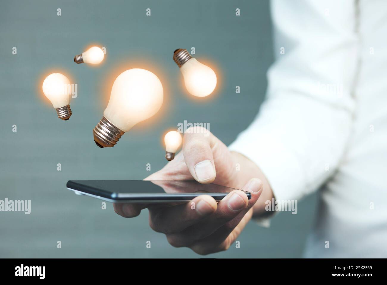 business man hand holding phone with idea Stock Photo - Alamy
