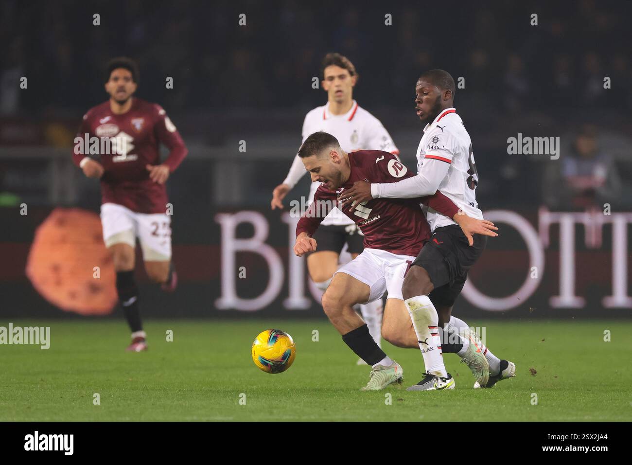 Turin, Italy, 22nd February 2025. Yunus Musah of AC Milan crashes into ...