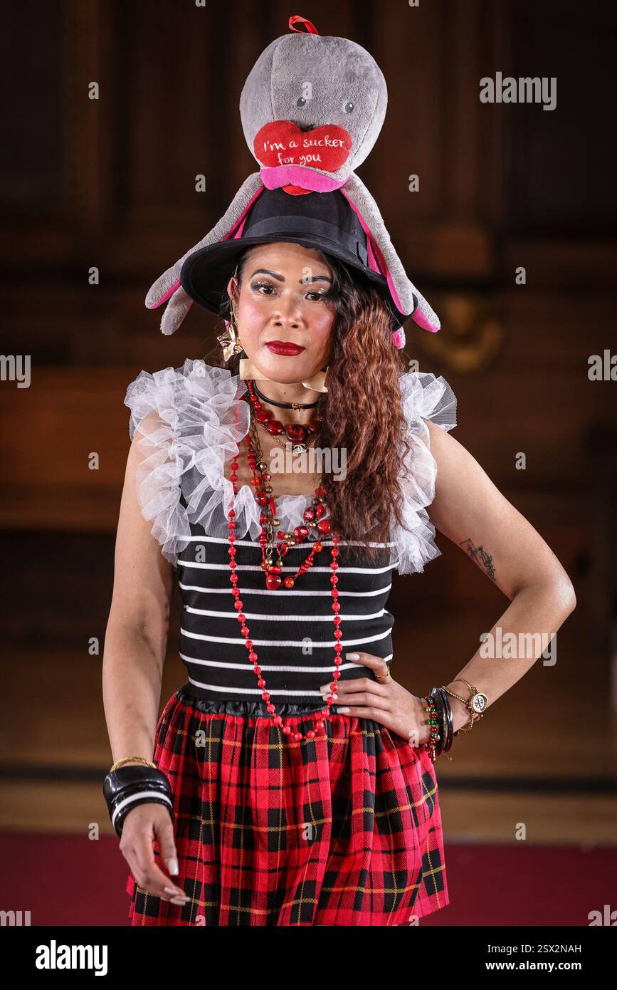 London, UK. 22nd Feb 2025. Models pose and walk the runway at a fashion ...