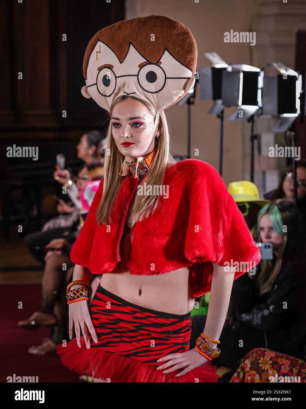 London, UK. 22nd Feb 2025. Models pose and walk the runway at a fashion ...