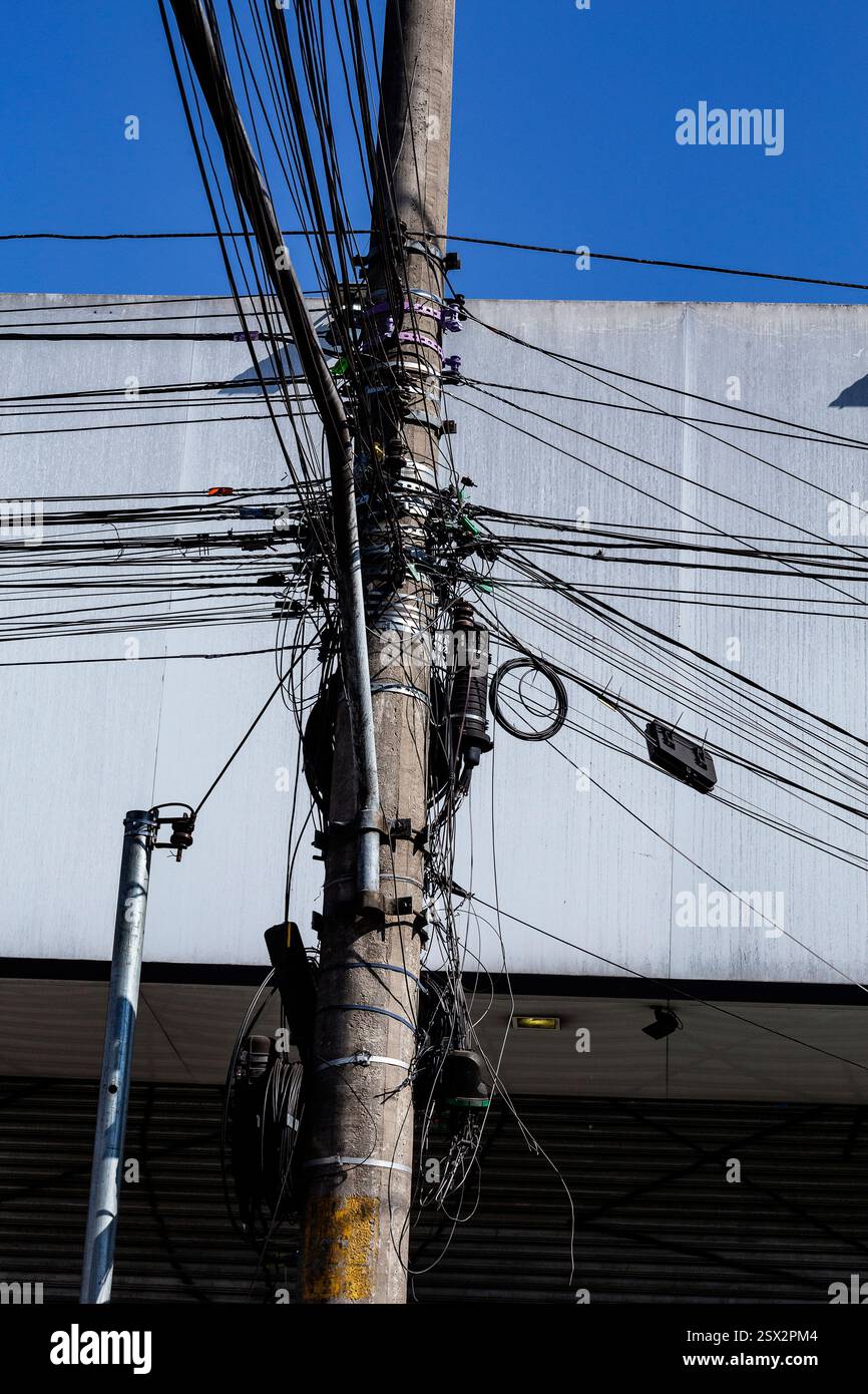 messy electricity wires on the pole, The chaos of cables and wires on ...