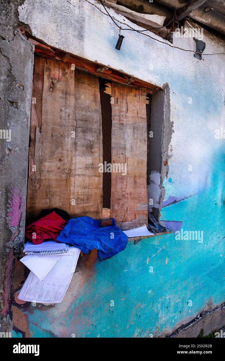 window closed with wood in favela alley, poor neighborhood of Diadema ...