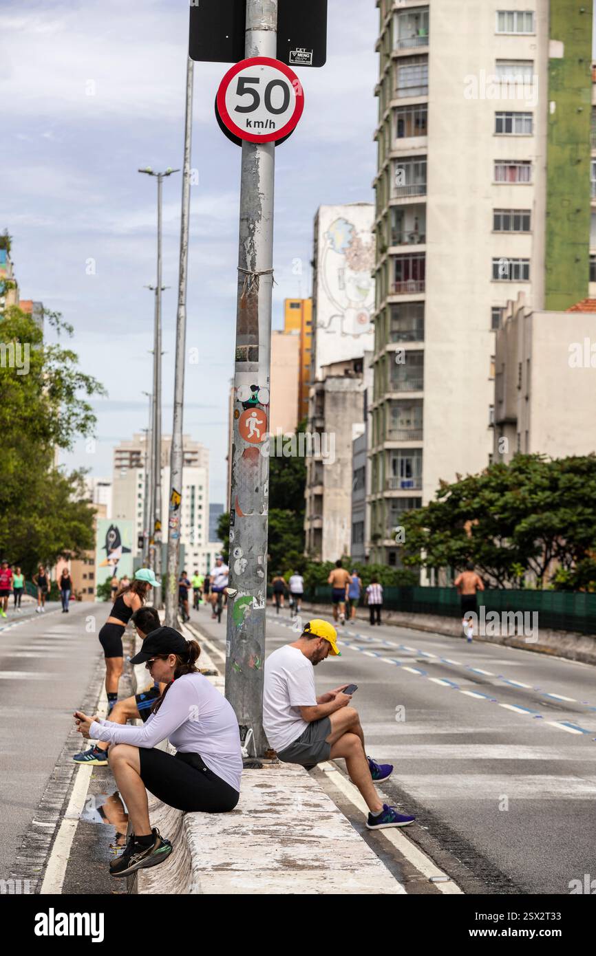 Sao Paulo, Brazil - jan 26, 2025: People enjoying the weekend and look ...