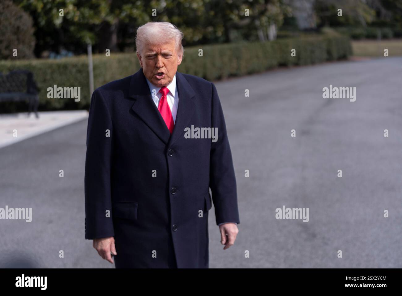 President Donald Trump speaks to reporters before leaving the White ...