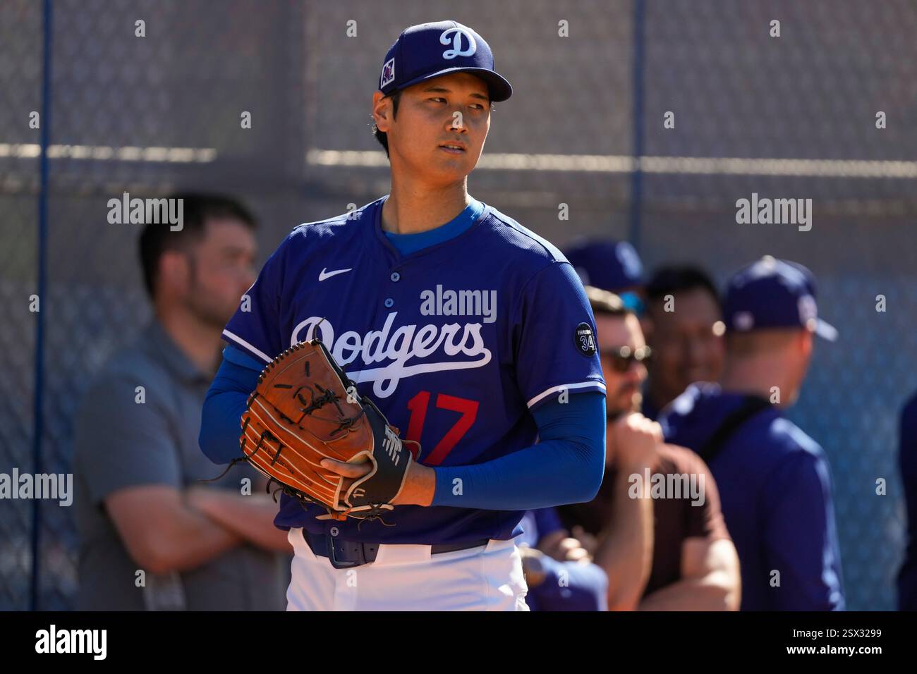 Los Angeles Dodgers two-way player Shohei Ohtani throws during a spring ...