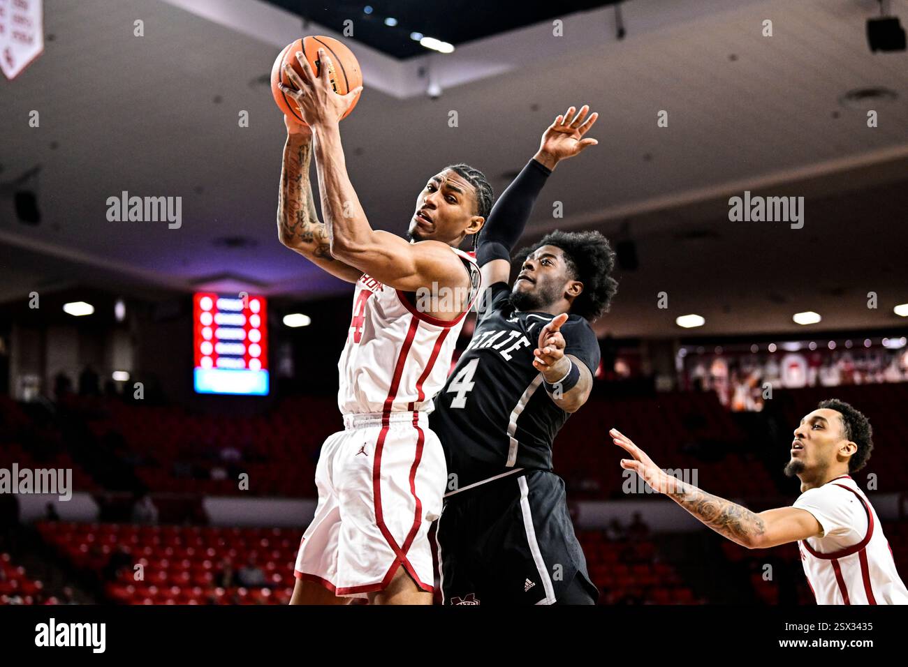 Oklahoma forward Jalon Moore (14) grabs a rebound ahead of Mississippi ...
