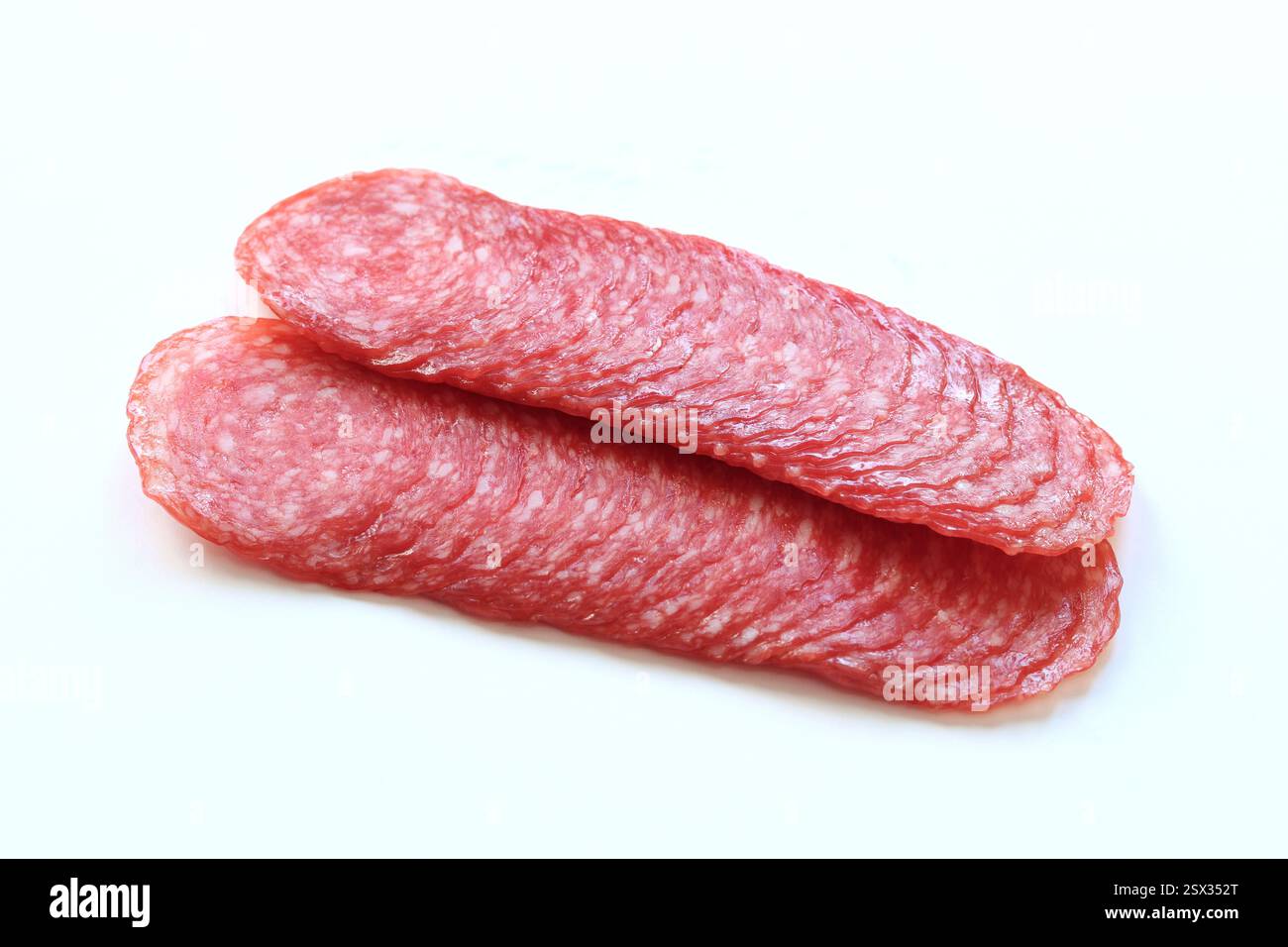 Thinly sliced salami sausage close-up. Side view of tasty sliced ...