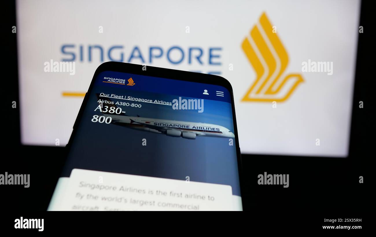 In this photo illustration, a mobile phone with the website of airline ...