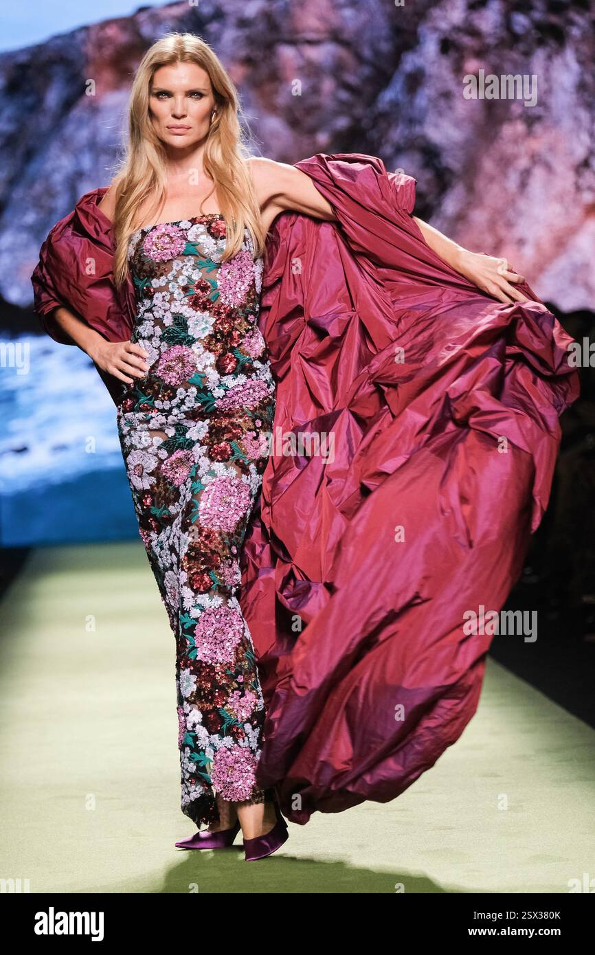 Esther Canadas walks the runway wearing a design by Lola Casademunt ...