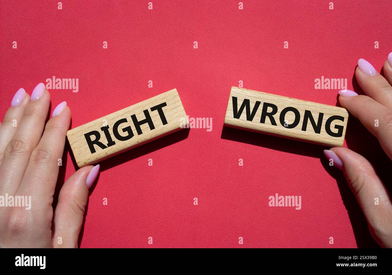 Right or Wrong symbol. Concept word Right or Wrong on wooden blocks. Businessman hand. Beautiful ...