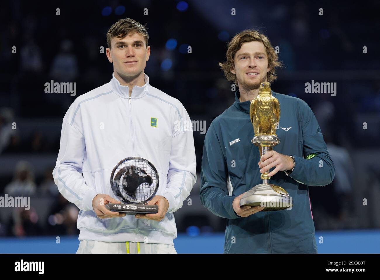 Russia's Andrey Rublev (R) and Britain's Jack Draper pose on the podium ...