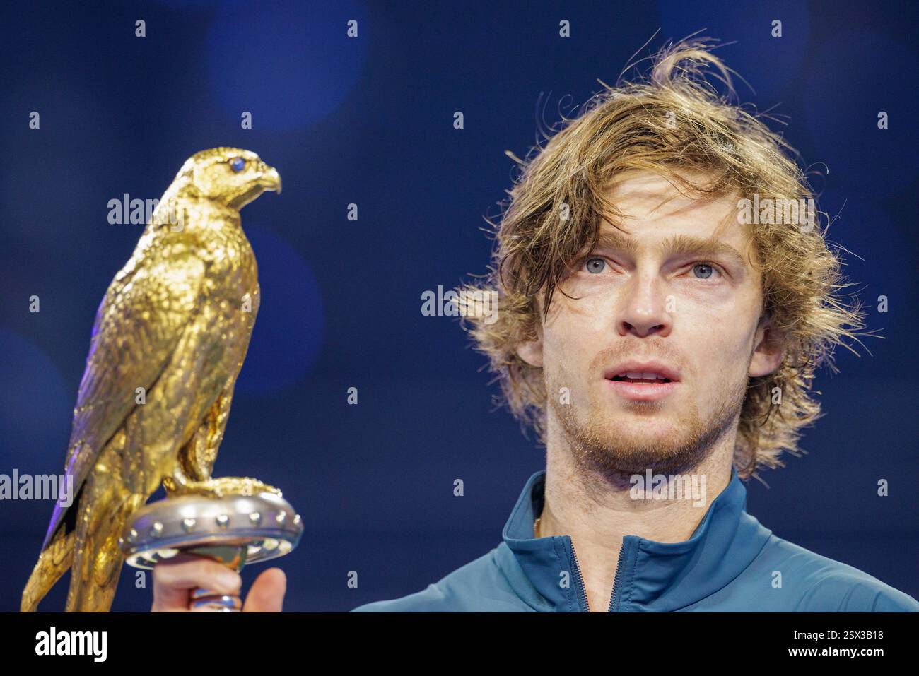 Andrey Rublev of Russia celebrates with the trophy on the podium after ...