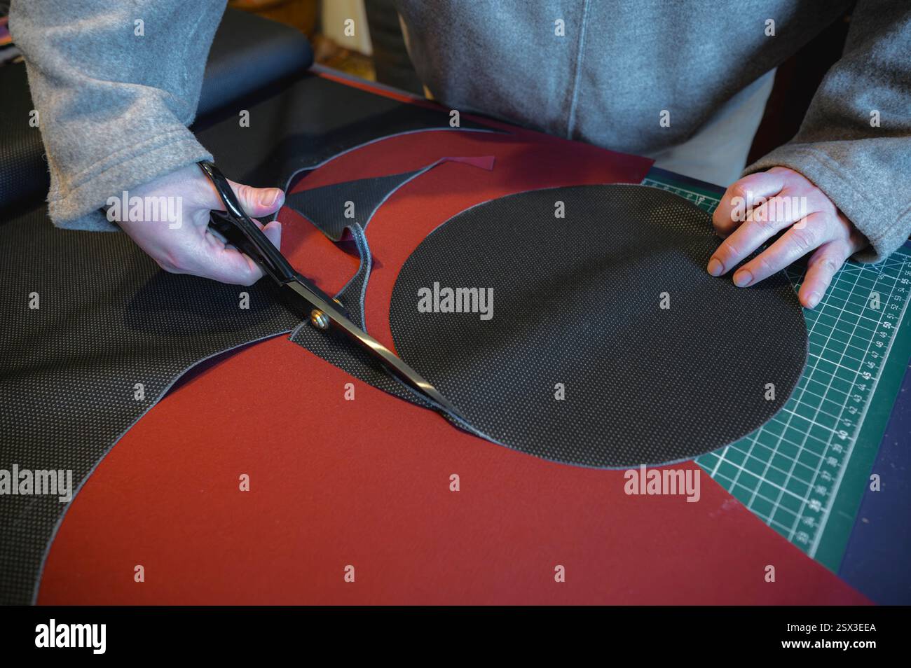 Handmade tailoring workshop, the process of marking and cutting fabric ...