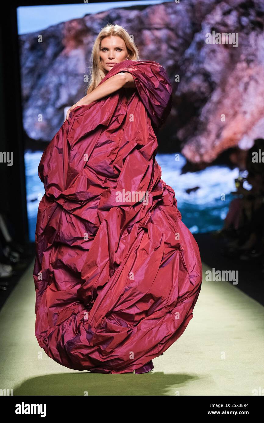 Esther Canadas walks the runway wearing a design by Lola Casademunt ...