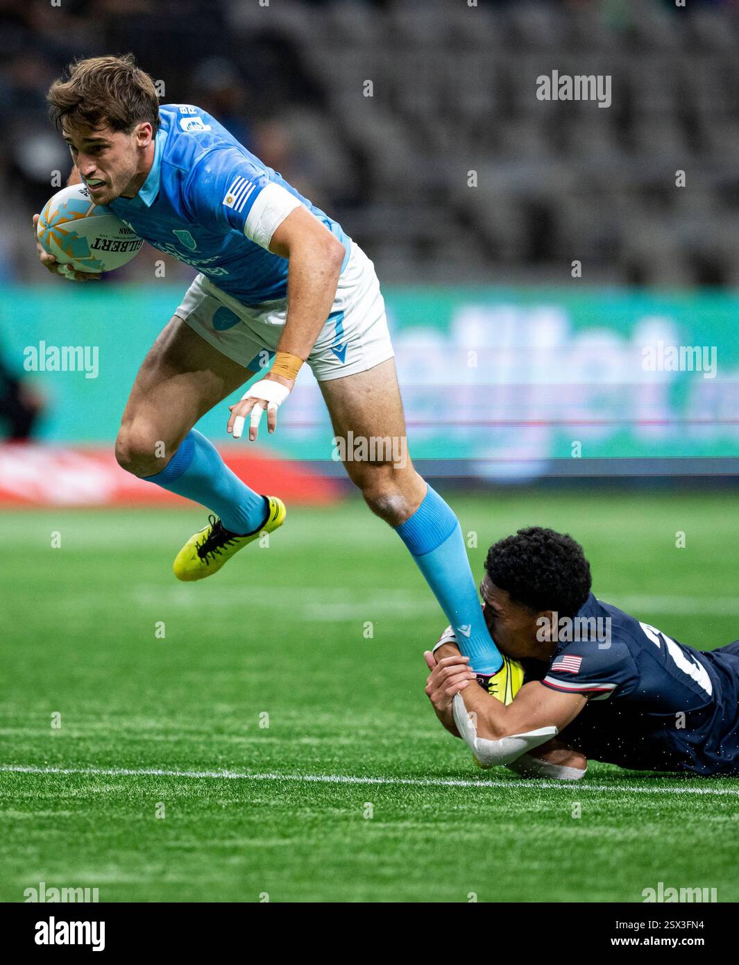 Uruguay's Mateo Vinals is tackled by United States' Pita Vi during a ...