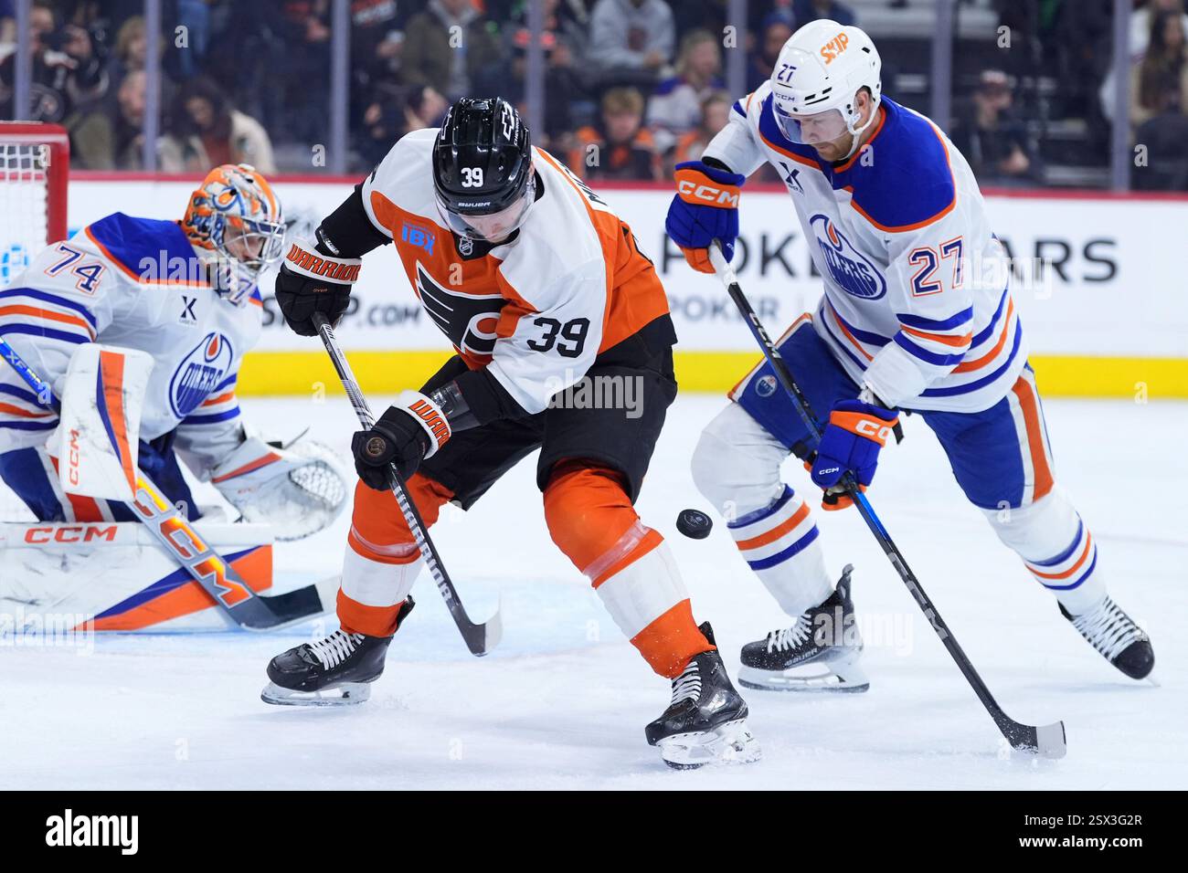 Philadelphia Flyers' Matvei Michkov (39) battles for the puck with ...