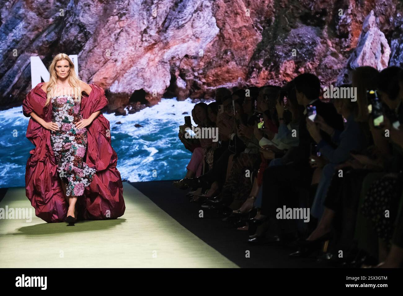 Esther Canadas walks the runway wearing a design by Lola Casademunt ...