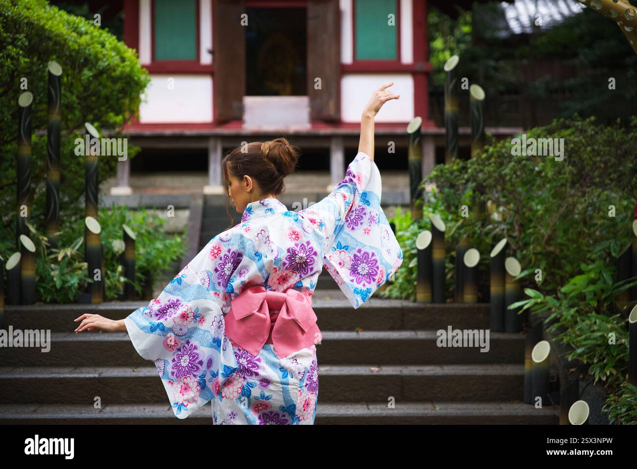 Graceful Woman in Kimono Dancing Near Japanese Temple Stock Photo - Alamy