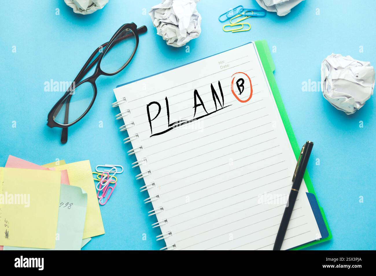 plan b text written on notebook on blue background Stock Photo - Alamy