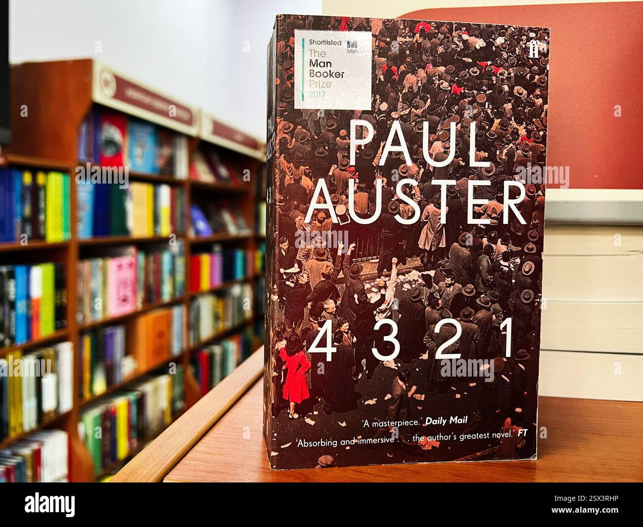 Lviv, Ukraine - February 20, 2025: Book titled 4 3 2 1 by Paul Auster ...