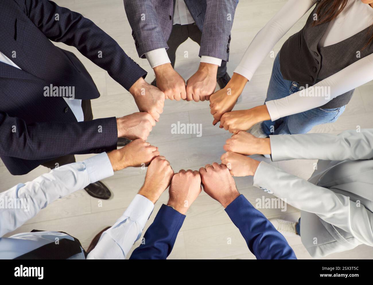 Team Members Engaging in a Collaborative Fist Bump Circle During a ...
