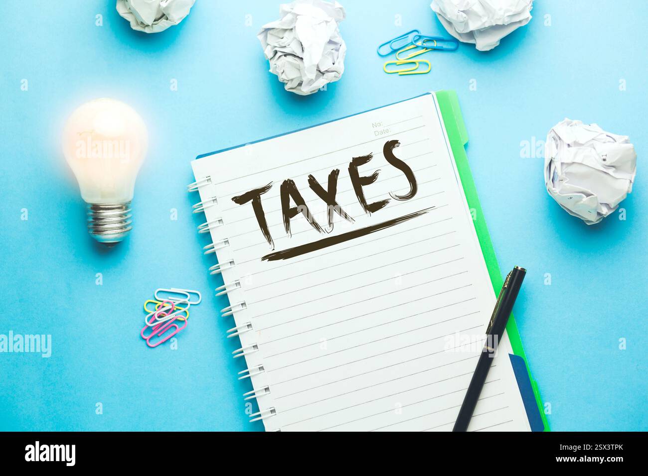 Text taxes on the white paper with idea on blue table Stock Photo - Alamy