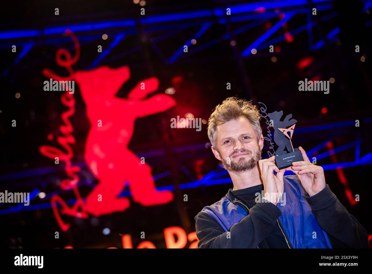 Berlin, Germany. 22nd Feb, 2025. Quenton Miller stands on the red carpet with the Berlinale ...