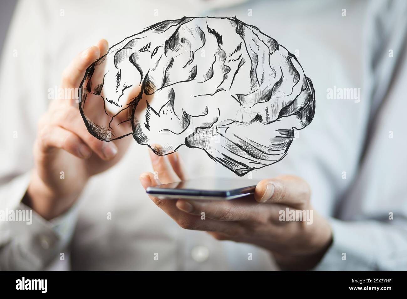 hand holding smartphone with brain in screen Stock Photo - Alamy