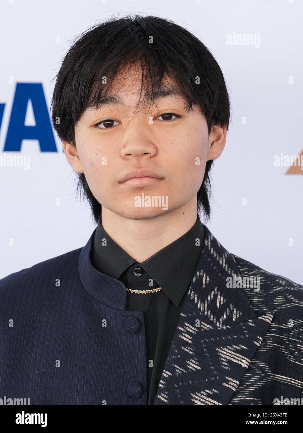 Los Angeles, USA. 22nd Feb, 2025. Izaac Wang walking on the red carpet at the 2025 Film ...