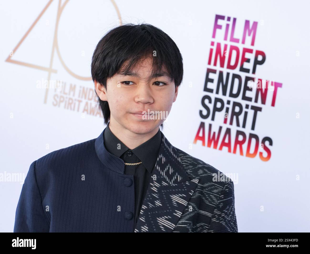 Los Angeles, USA. 22nd Feb, 2025. Izaac Wang walking on the red carpet at the 2025 Film ...