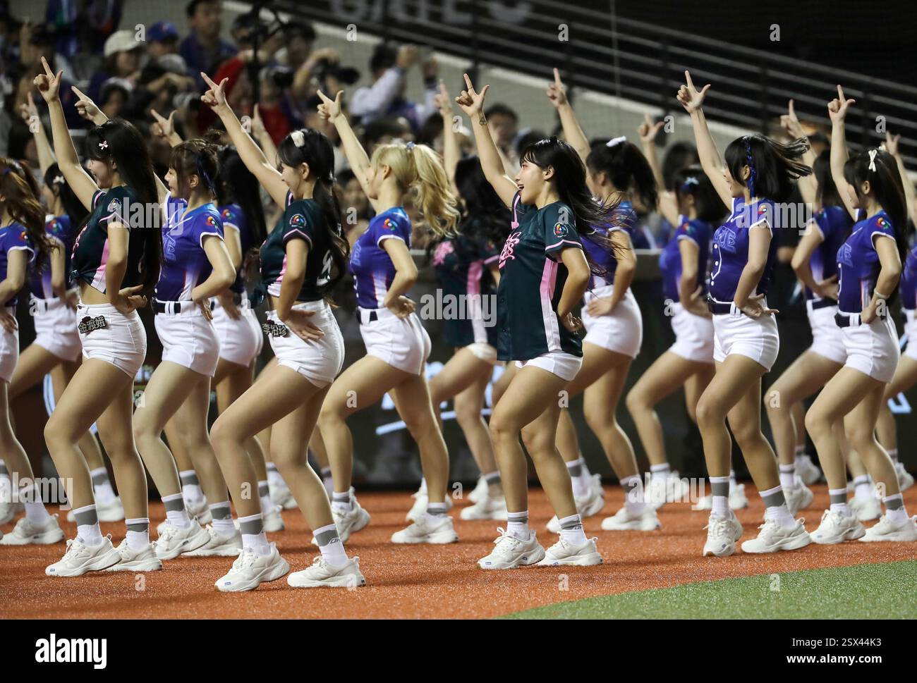 Members of CT AMAZE perform before the World Baseball Classic qualifying game between Taiwan and ...