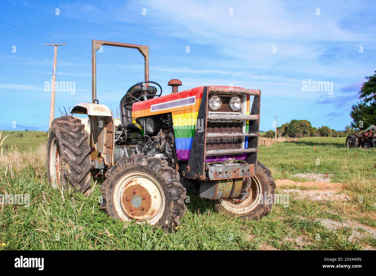 Agricultural tractor painted in the rainbow pride flag colours, outside ...