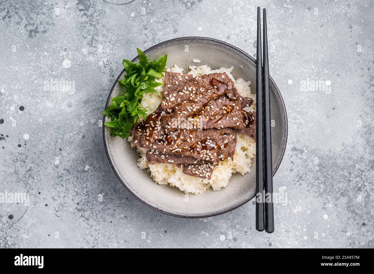 Delectable yakiniku feast, featuring a variety of marbled beef cuts and rice. A culinary journey ...