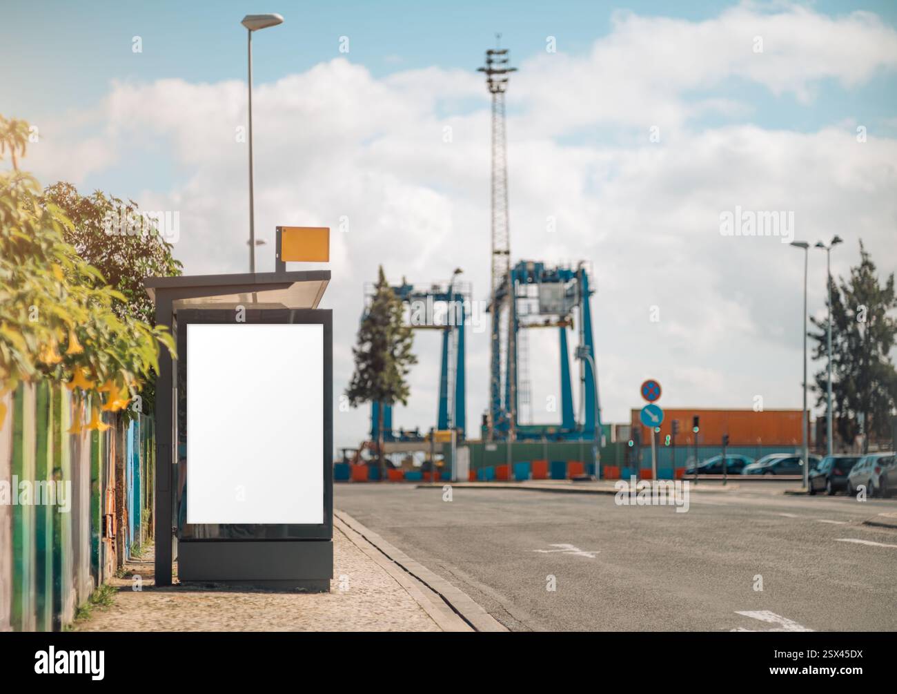 Blank bus stop advertisement mockup in urban industrial setting. Empty ...