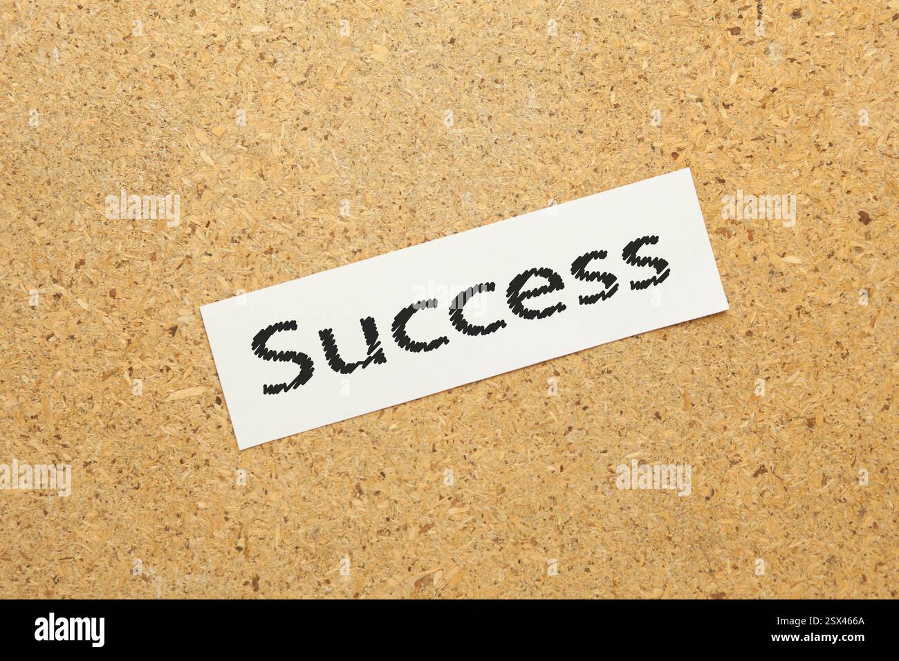 success text written on paper on brown background Stock Photo - Alamy